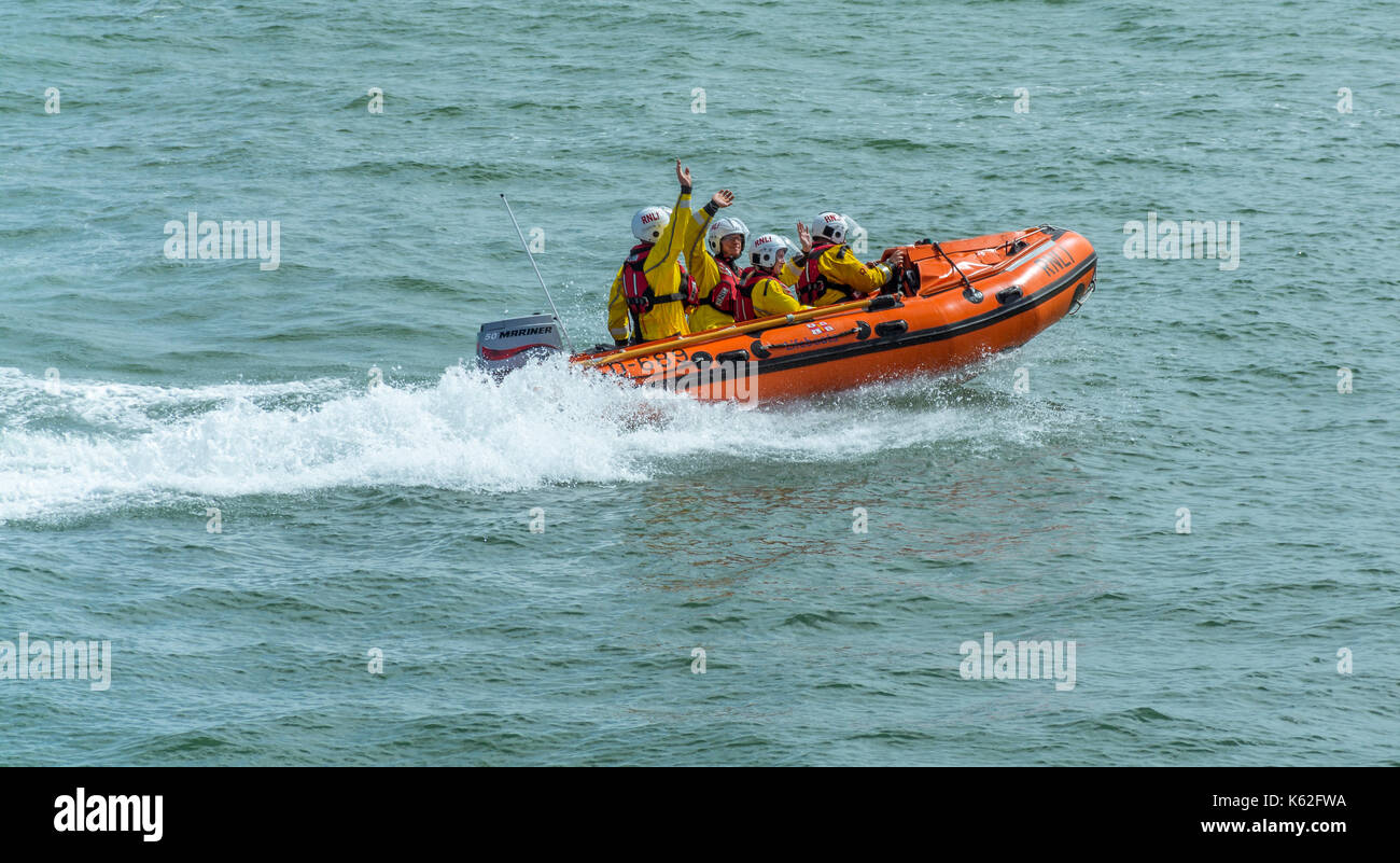 The inshore lifeboat races around the bay at Moelfre Lifeboat Day 2017 ...