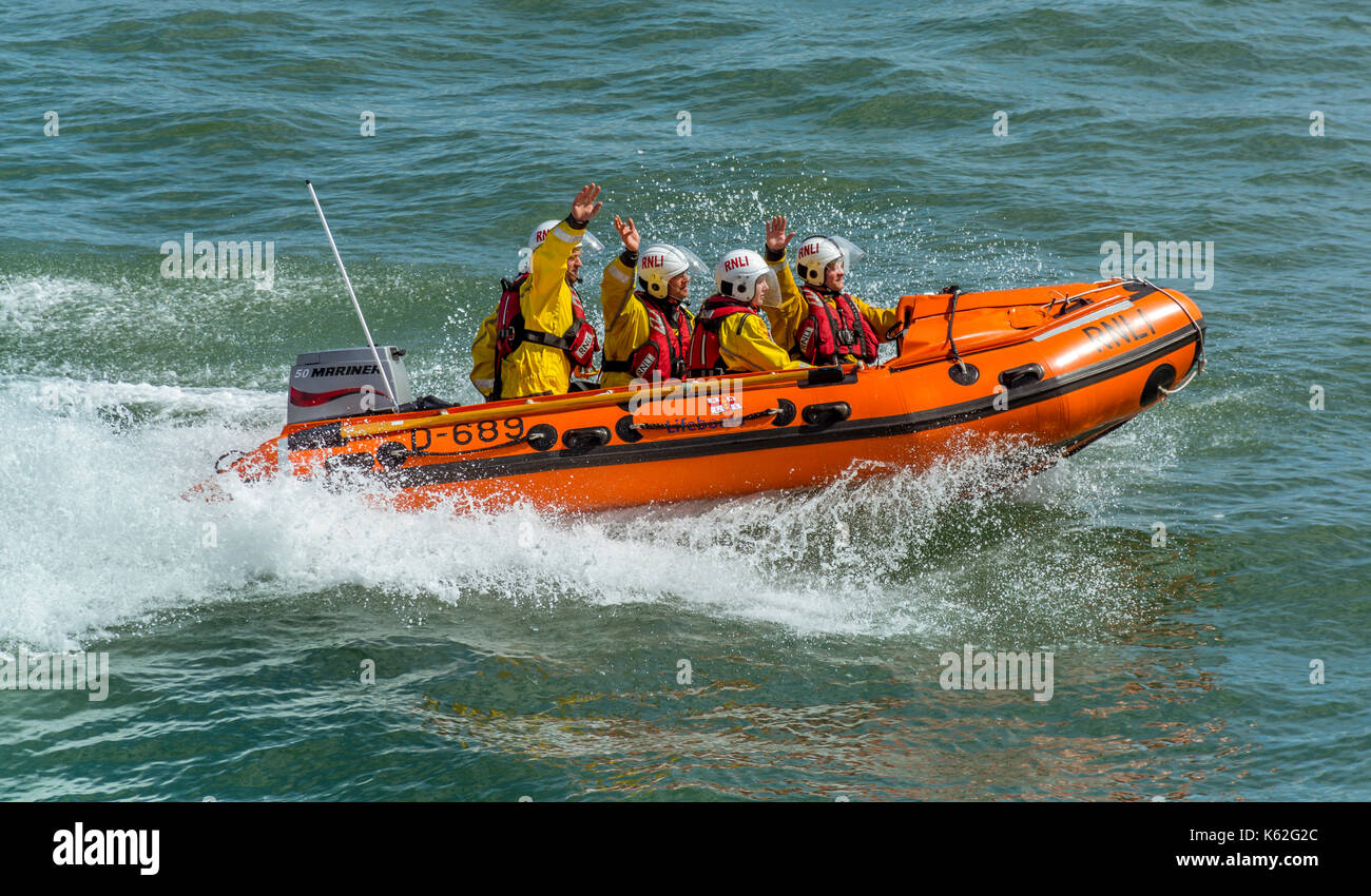 The inshore lifeboat races around the bay at Moelfre Lifeboat Day 2017 ...