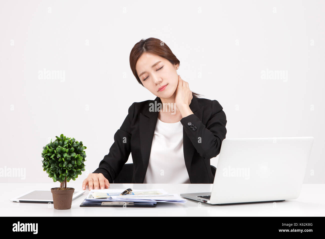 Woman stretching neck desk hi-res stock photography and images - Alamy