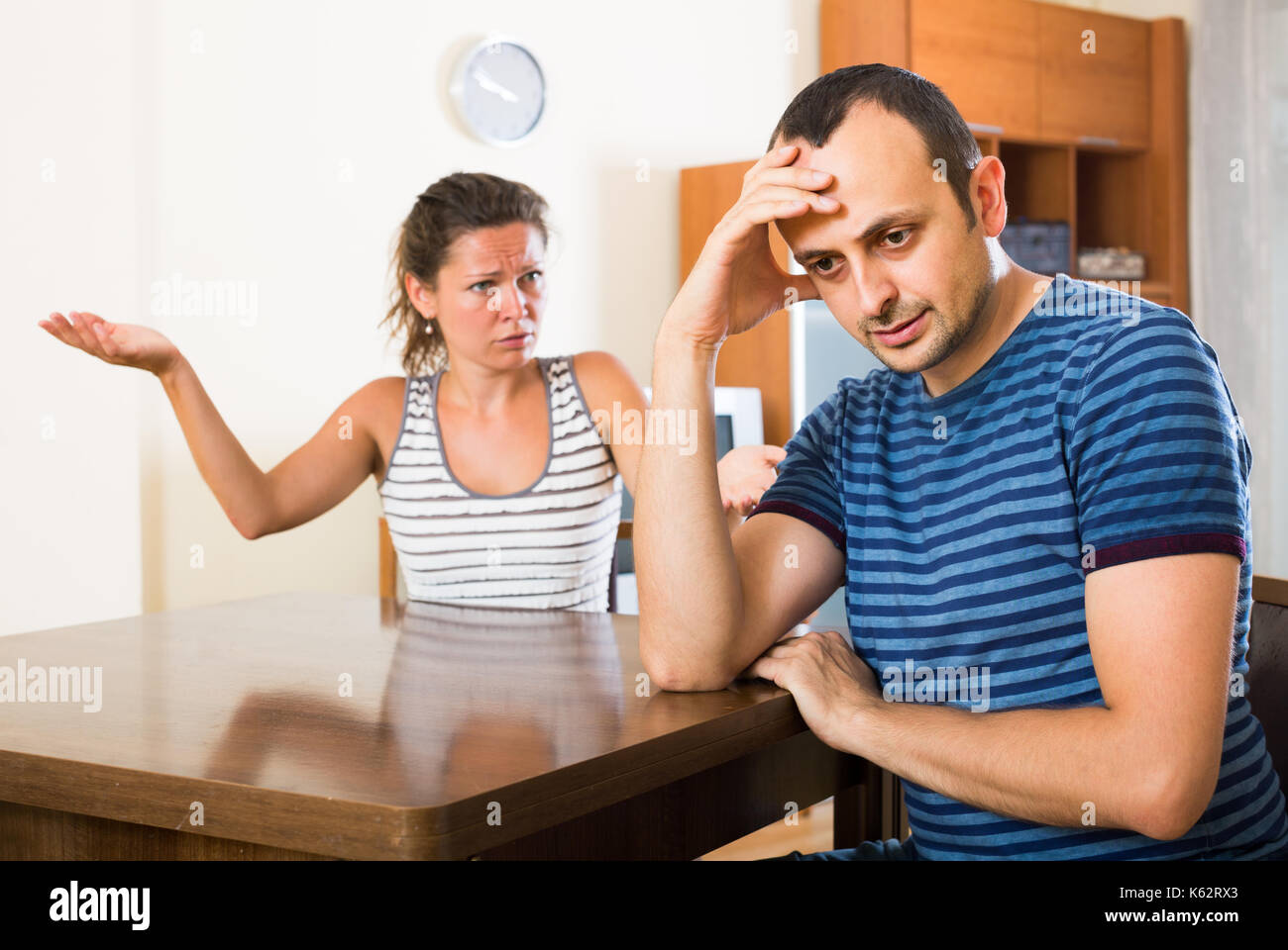 sad family couple shouting while arguing indoors Stock Photo - Alamy