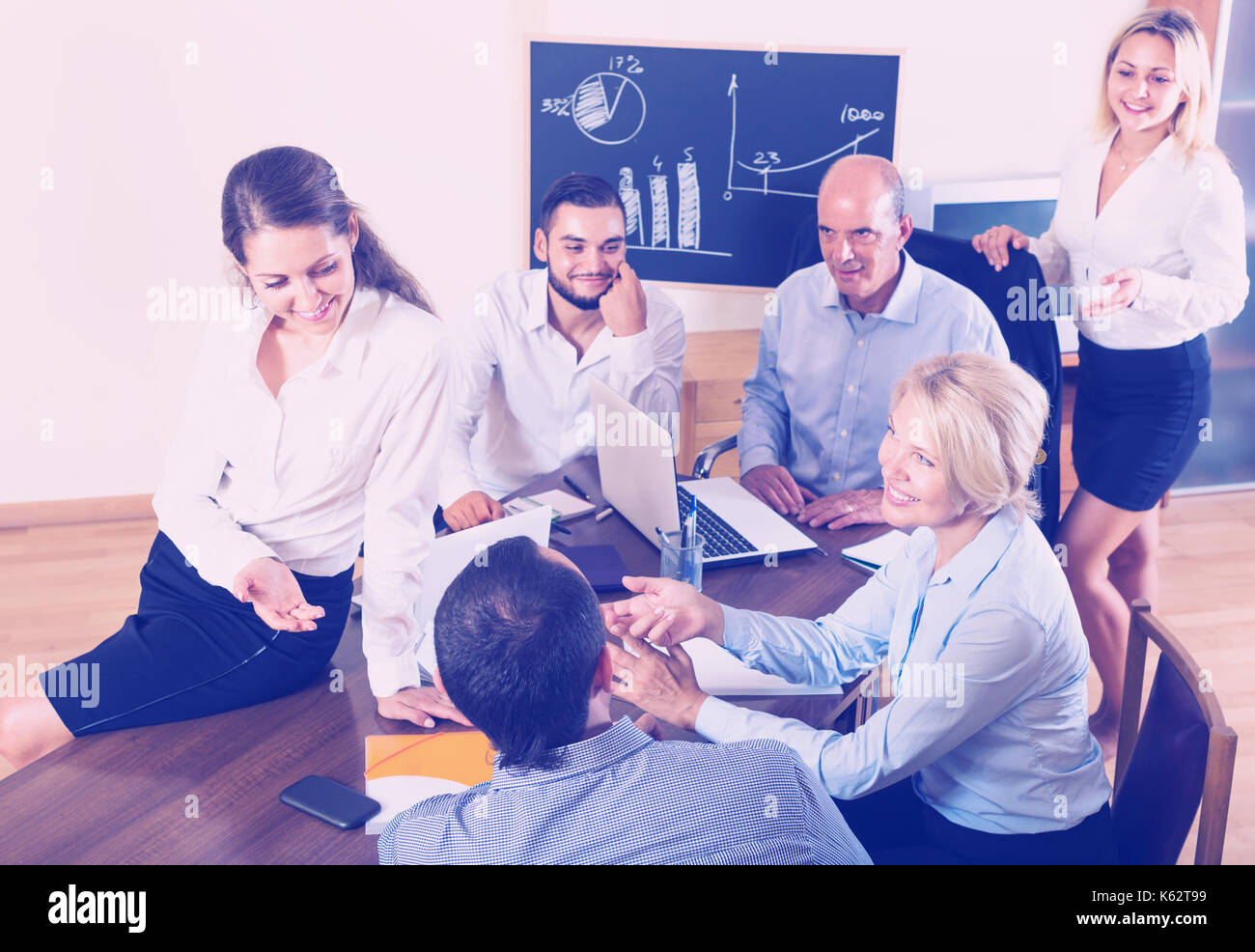 Successful happy business people having a break together in office ...