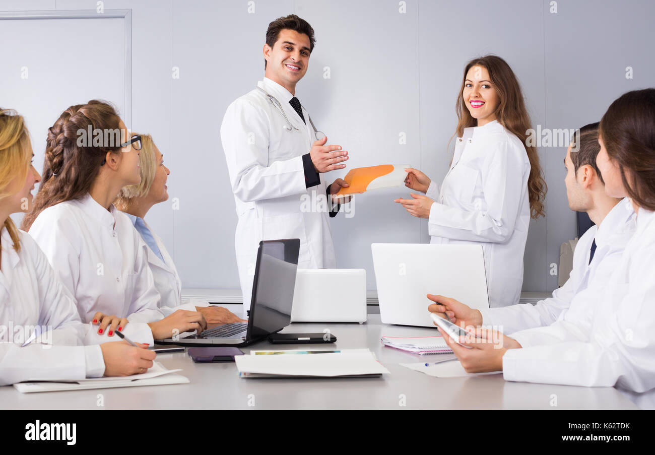 Health-care happy american positive workers and head physician at ...