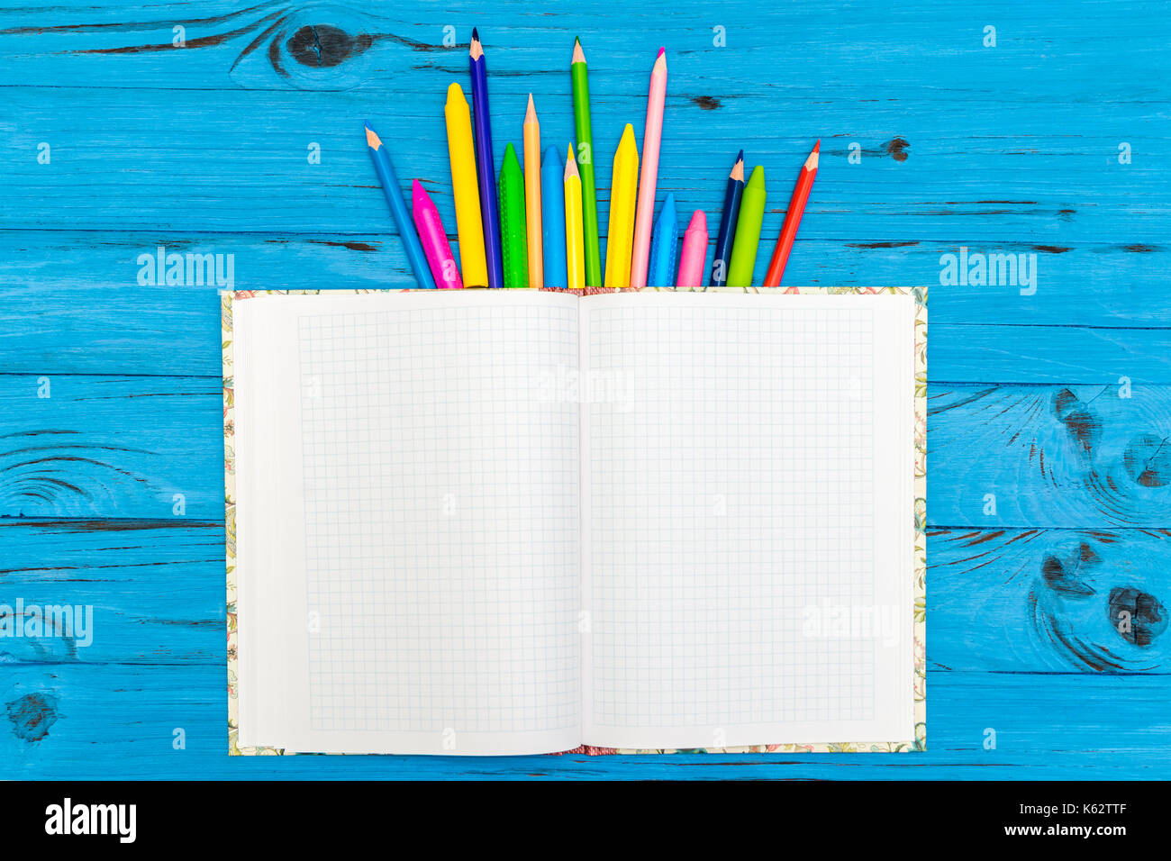 Color pencils and notepad. school concept Stock Photo - Alamy