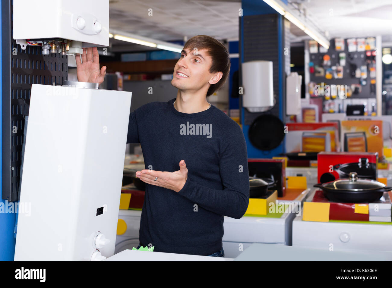 Young man electric heater hi-res stock photography and images - Alamy