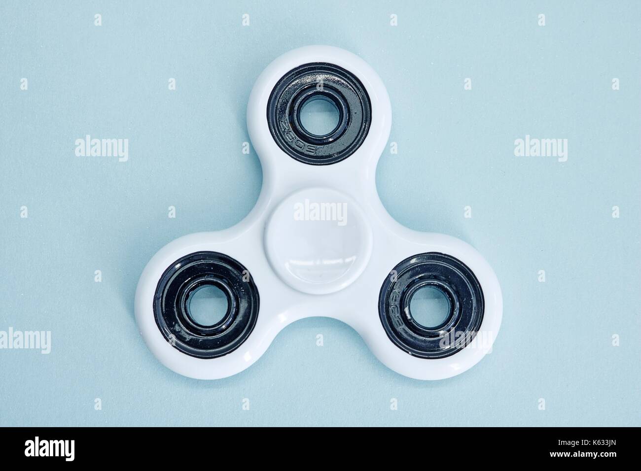A studio photo of a finger spinner Stock Photo - Alamy