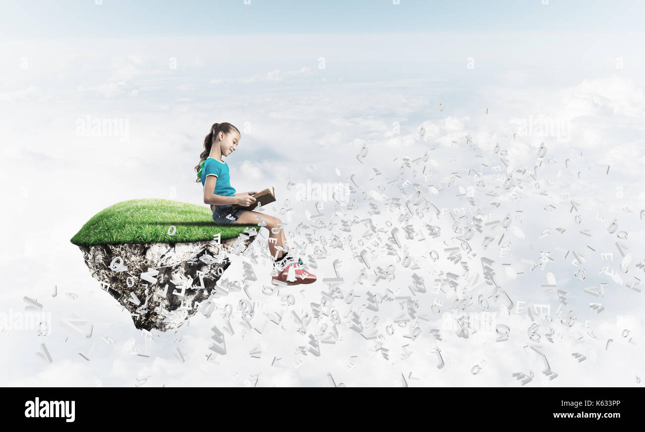 Girl of school age reading book as concept for education Stock Photo ...