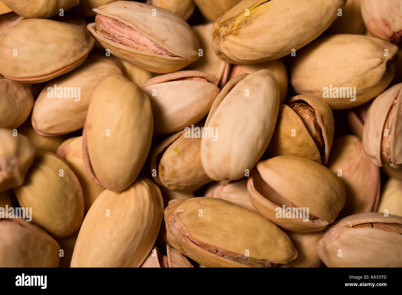 background from salty well roasted half open pistachios Stock Photo - Alamy