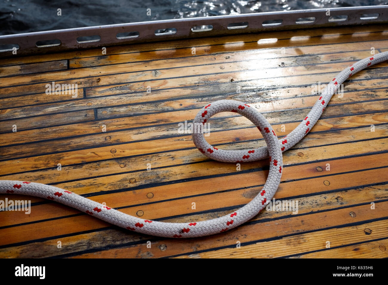 yellow wooden deck with rope Stock Photo - Alamy