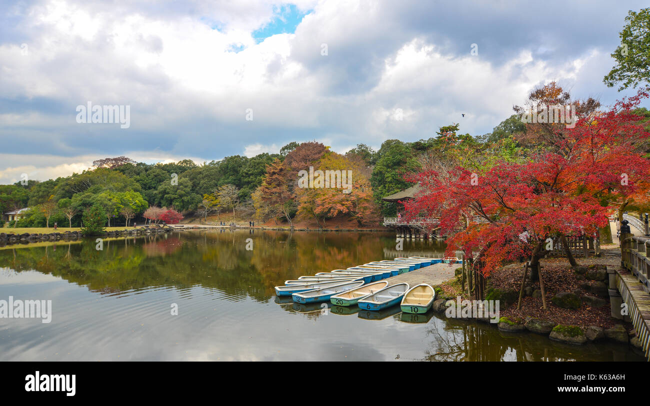 Autumn scenery with the lake and idle tourist boats in Nara, Kansai ...