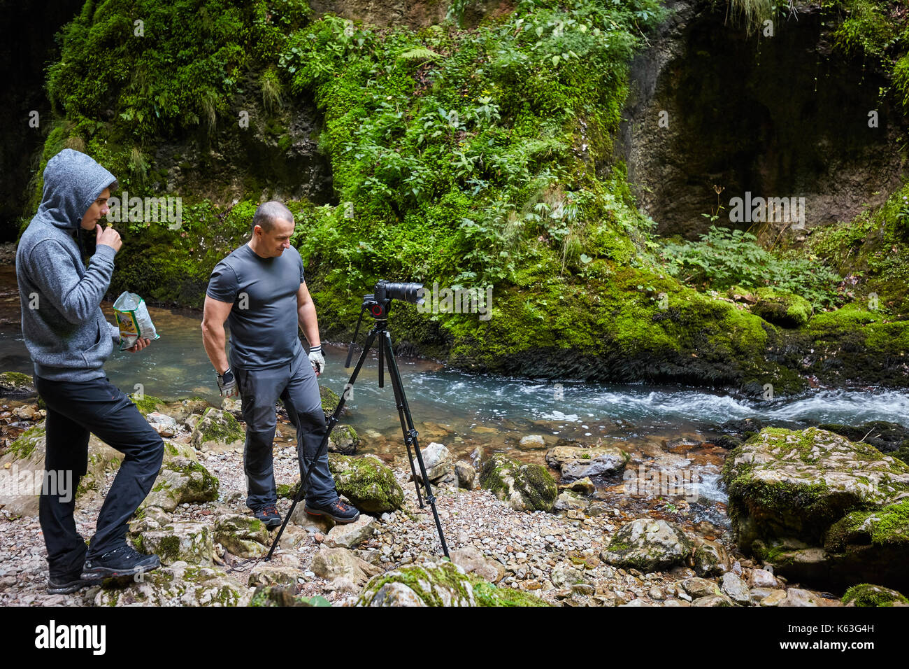 Professional nature photographer in a canyon by the river Stock Photo ...
