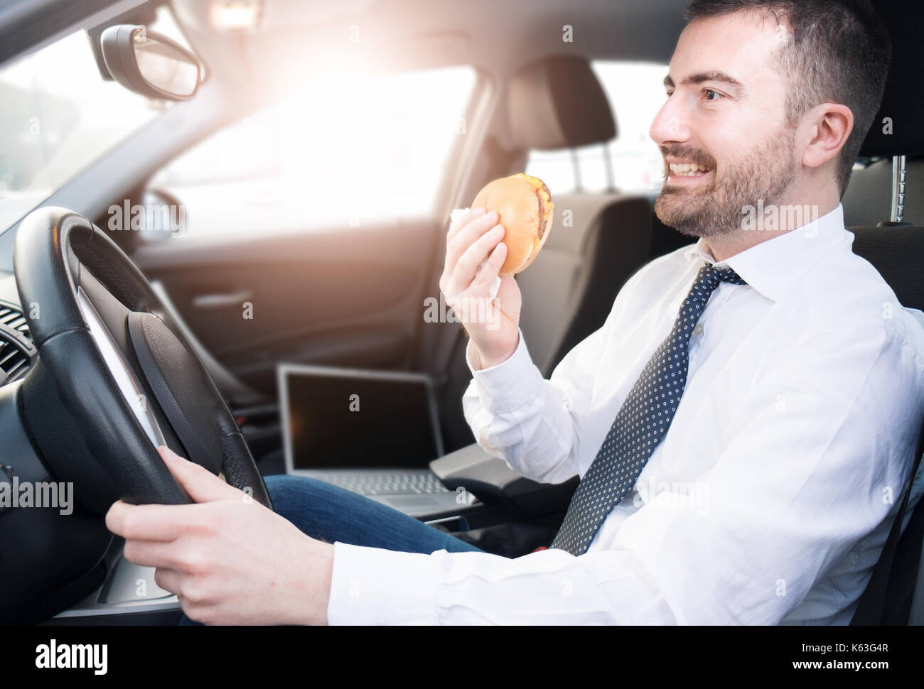 Man Eating Fast Food In A Car