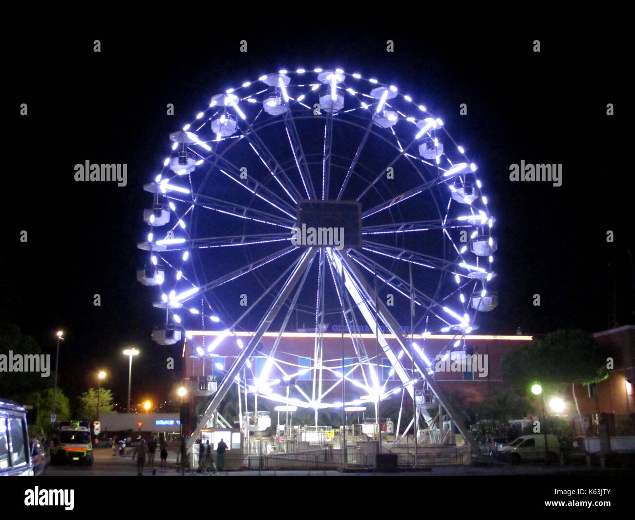 night shot carousel, panoramic wheel, illuminated Stock Photo - Alamy
