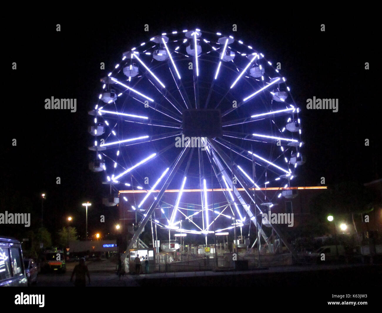 night shot carousel, panoramic wheel, illuminated Stock Photo - Alamy