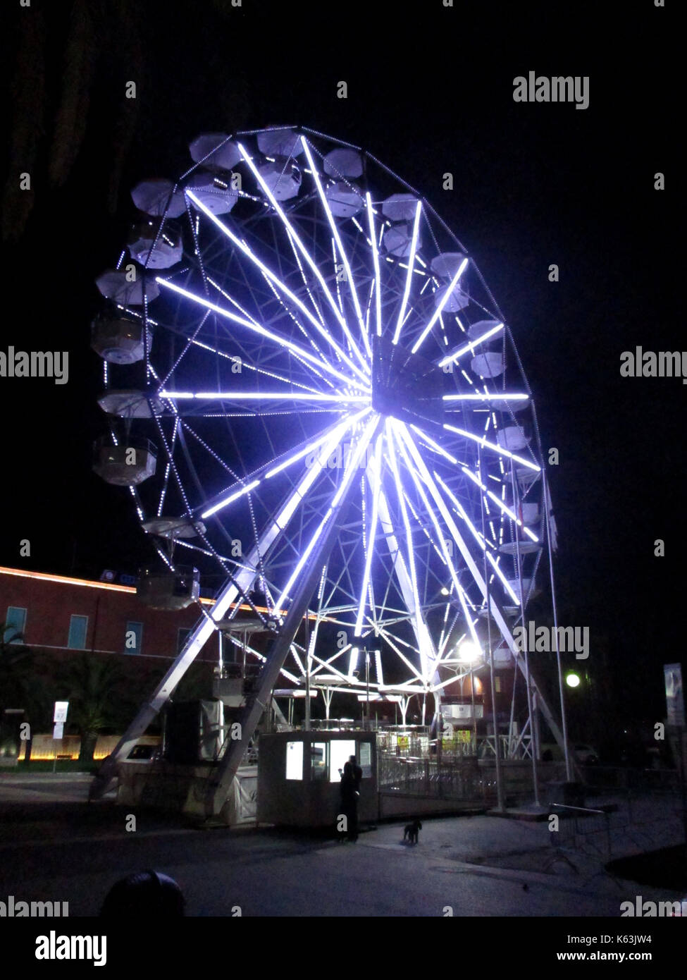 night shot carousel, panoramic wheel, illuminated Stock Photo - Alamy