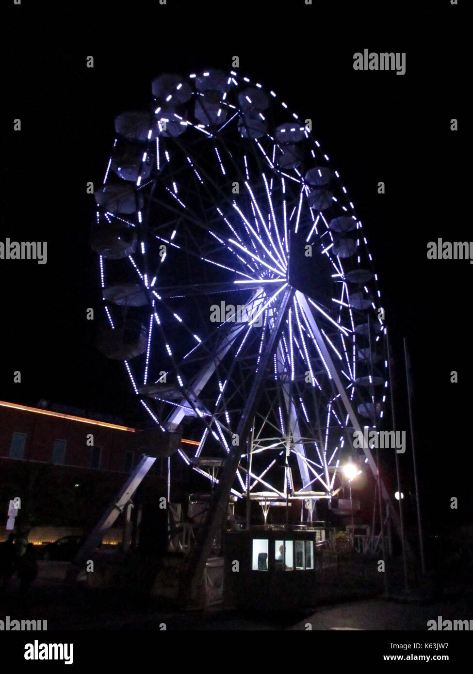 night shot carousel, panoramic wheel, illuminated Stock Photo - Alamy