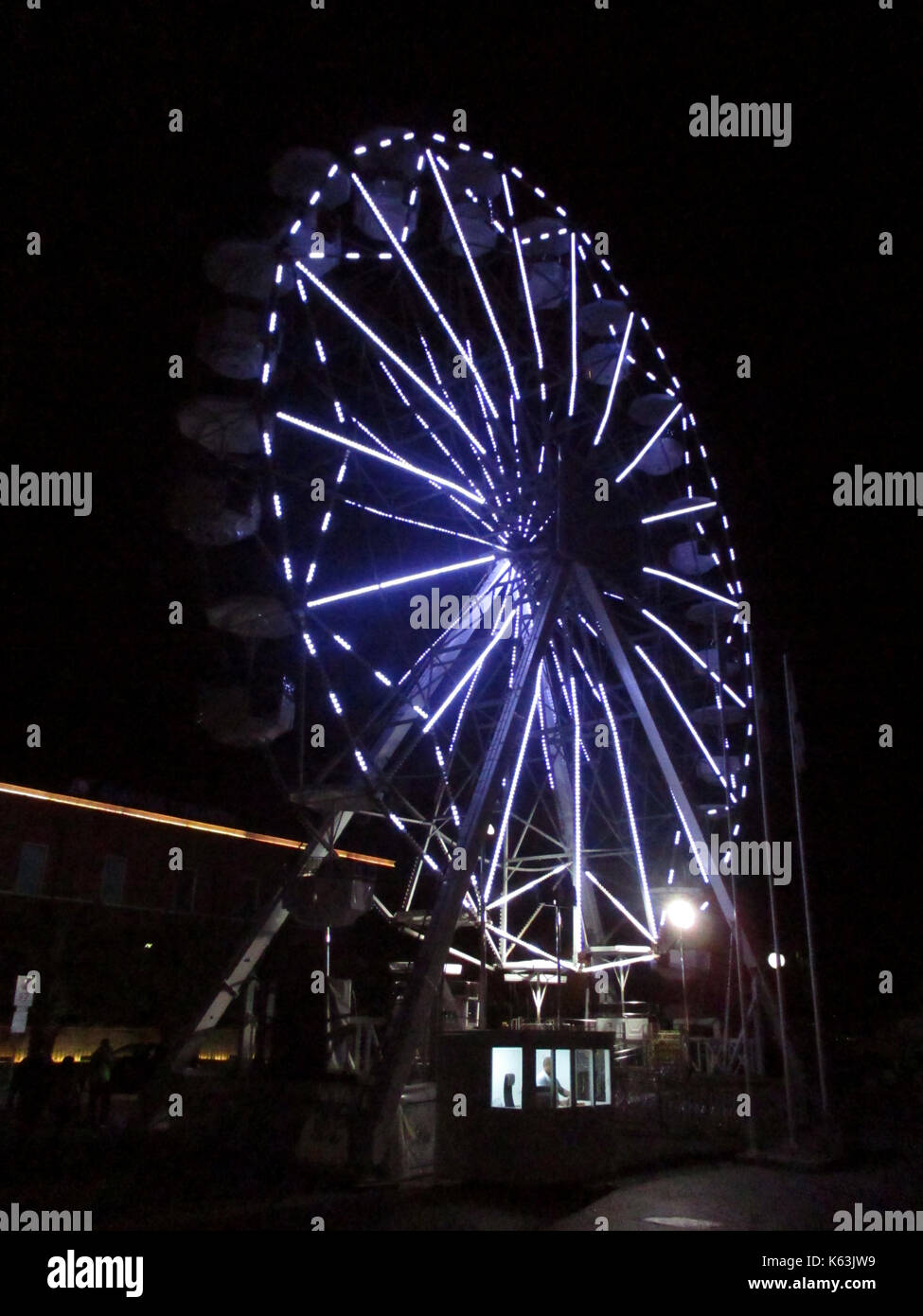 night shot carousel, panoramic wheel, illuminated Stock Photo - Alamy