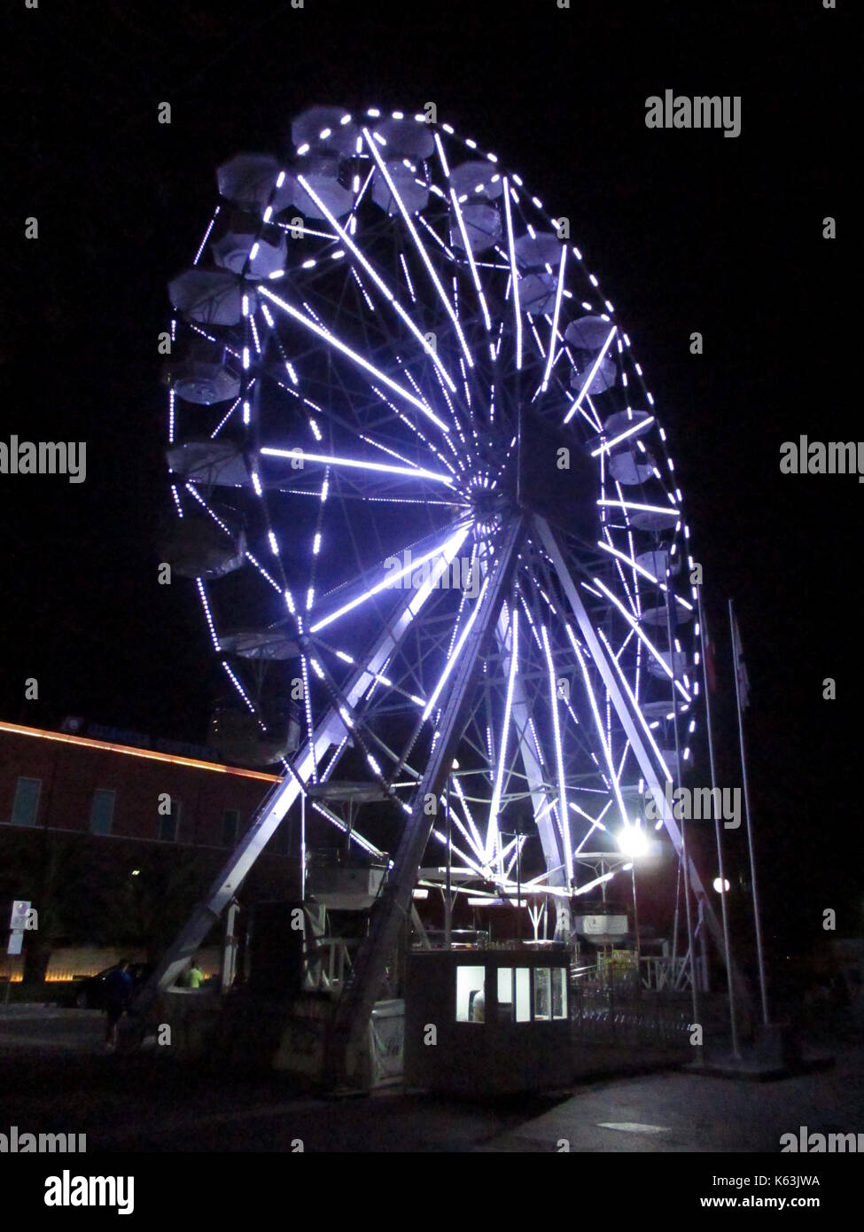 night shot carousel, panoramic wheel, illuminated Stock Photo - Alamy