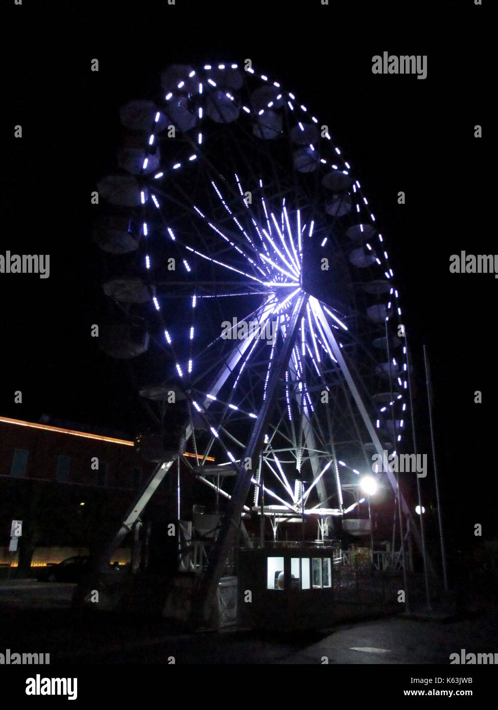 night shot carousel, panoramic wheel, illuminated Stock Photo - Alamy