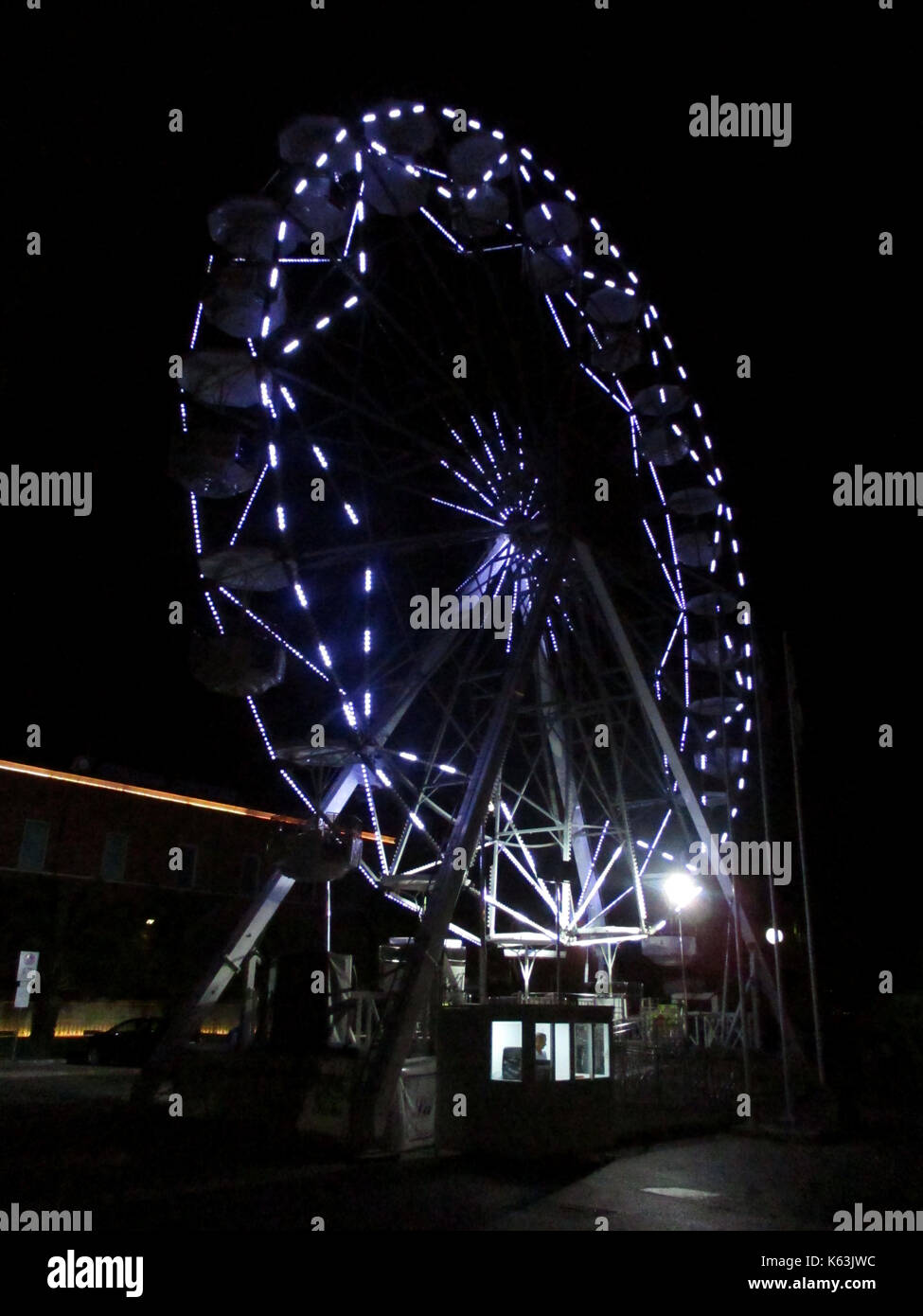 night shot carousel, panoramic wheel, illuminated Stock Photo - Alamy