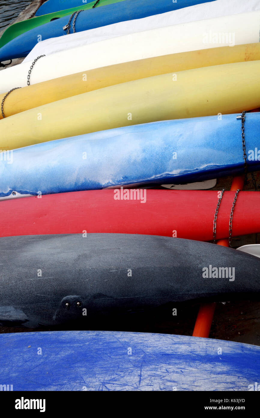 various colorful canoes turned on the mainland Stock Photo - Alamy