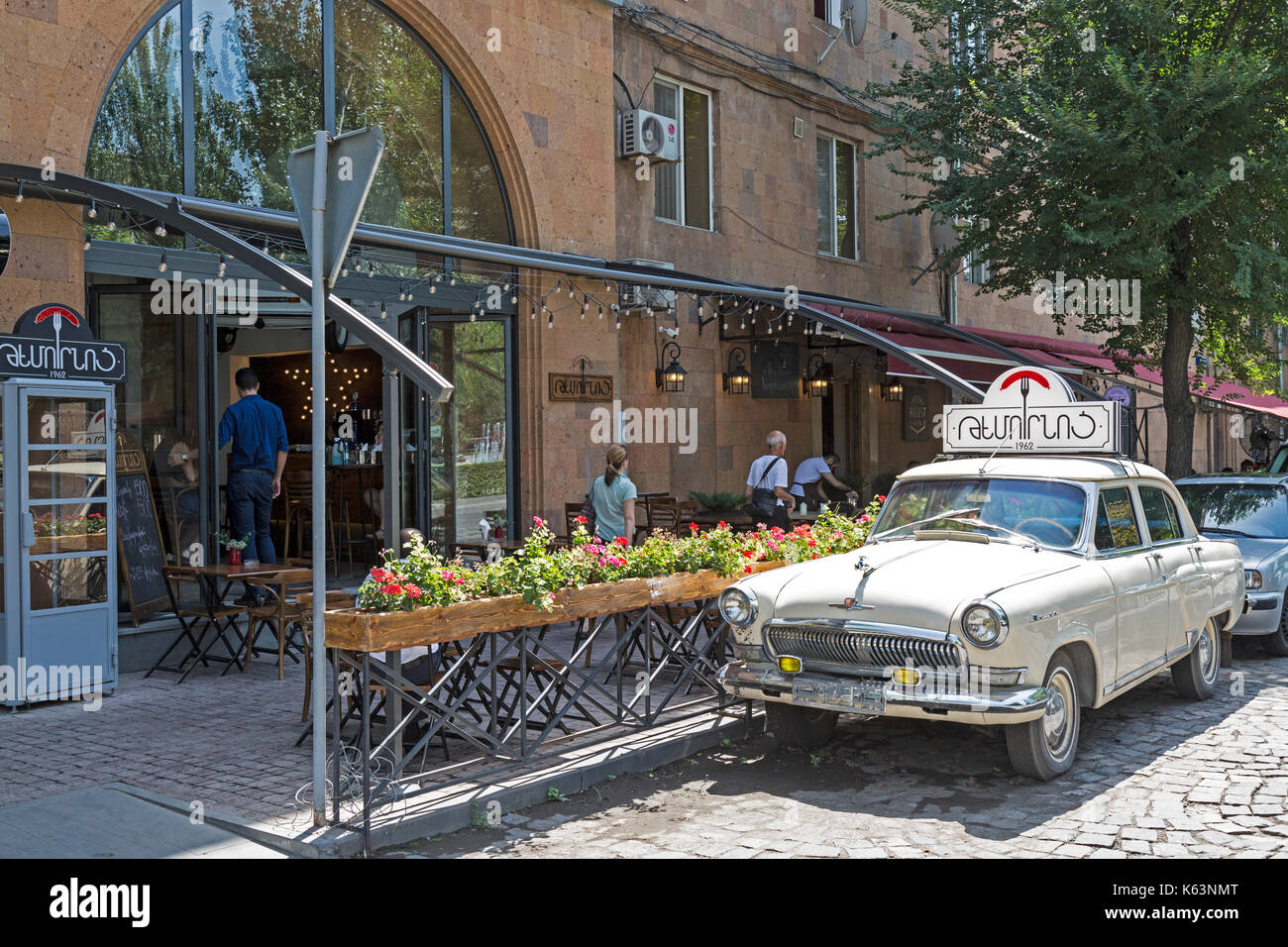 Street in Yerevan, Armenia, with restaurants and cafes. Vintage car ...