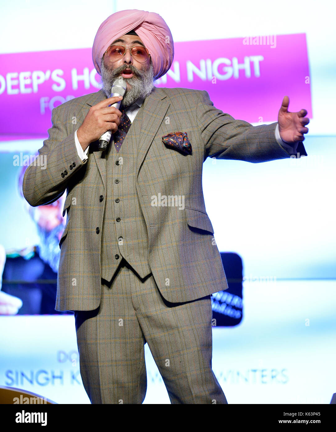 Hardeep Singh Kohli comedian on stage Stock Photo - Alamy