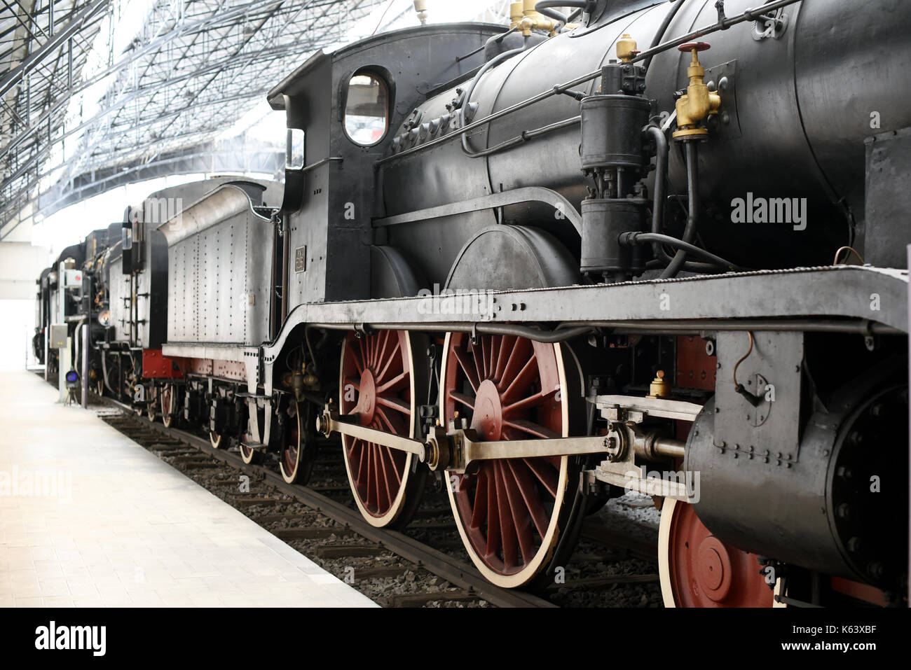 Old vintage train with steam locomotive standing at railway station ...