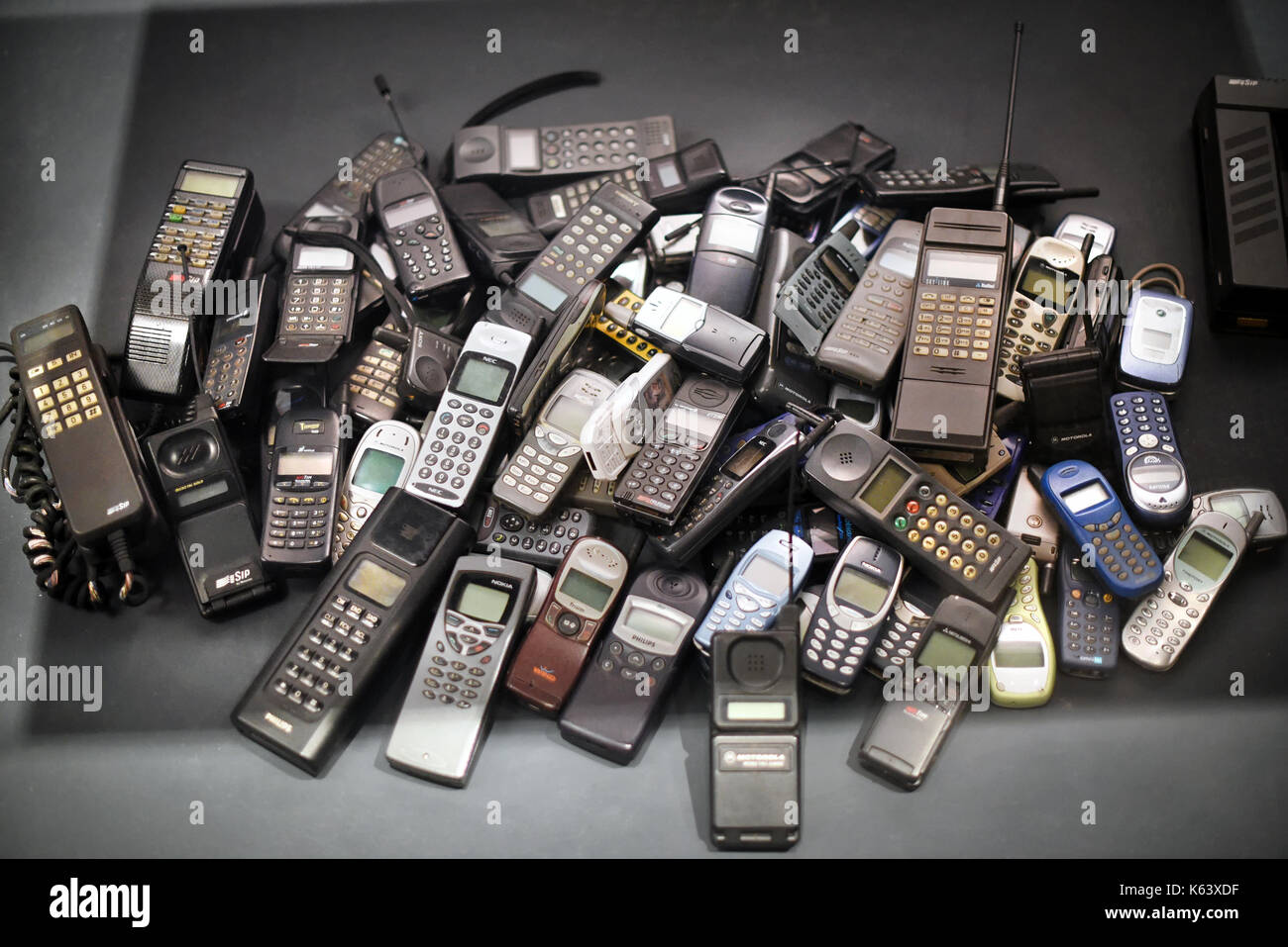 Stack of old vintage mobile phones on dark background Stock Photo - Alamy