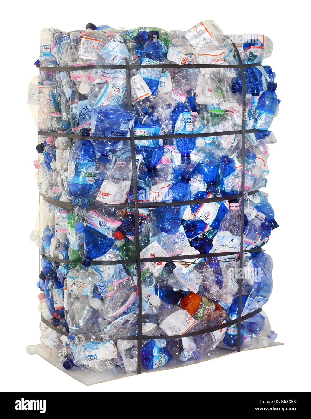 Recycling concept of crushed plastic bottles in wire container isolated ...