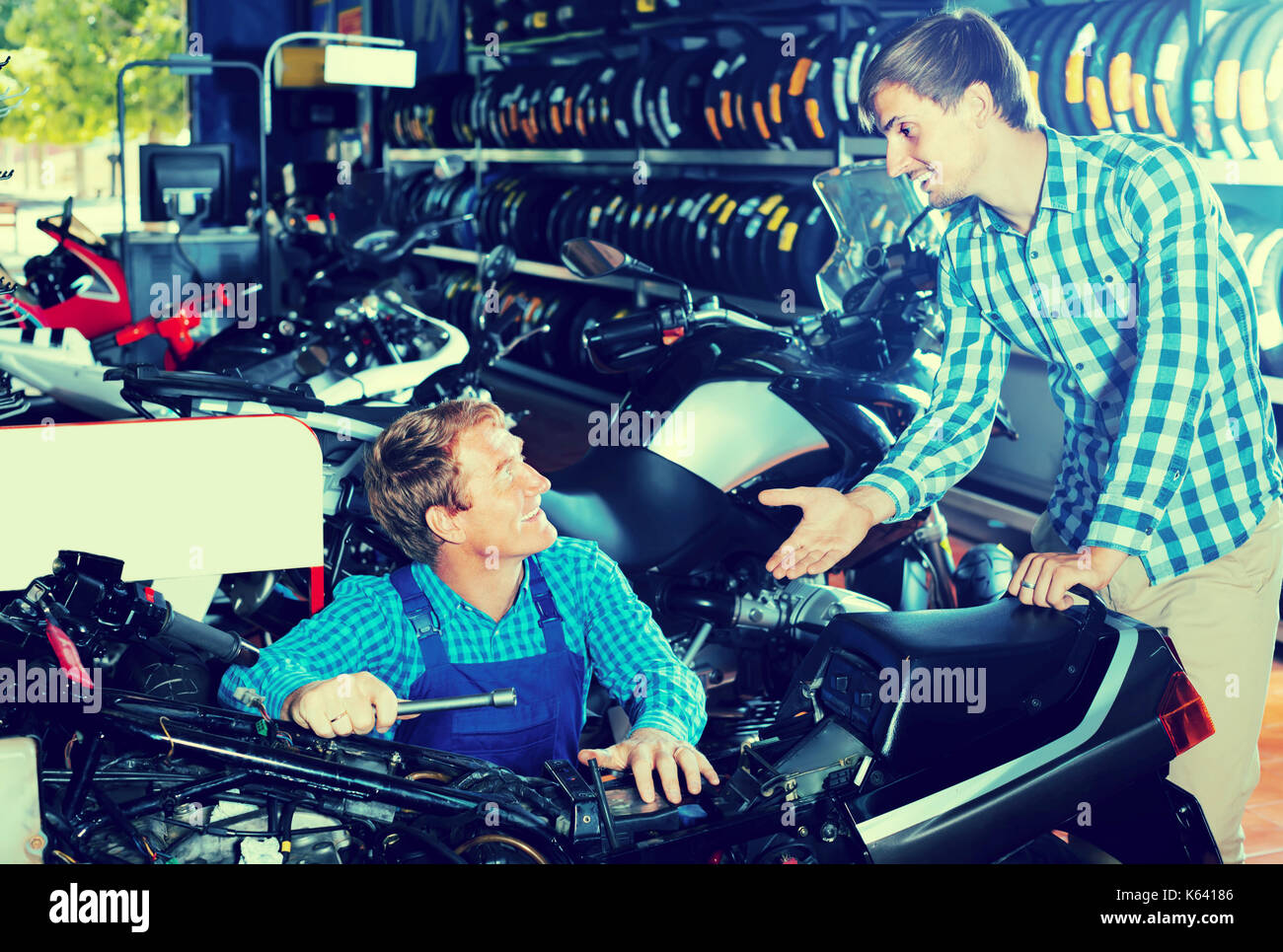 Mechanic man examining maintenance customer hi-res stock photography ...