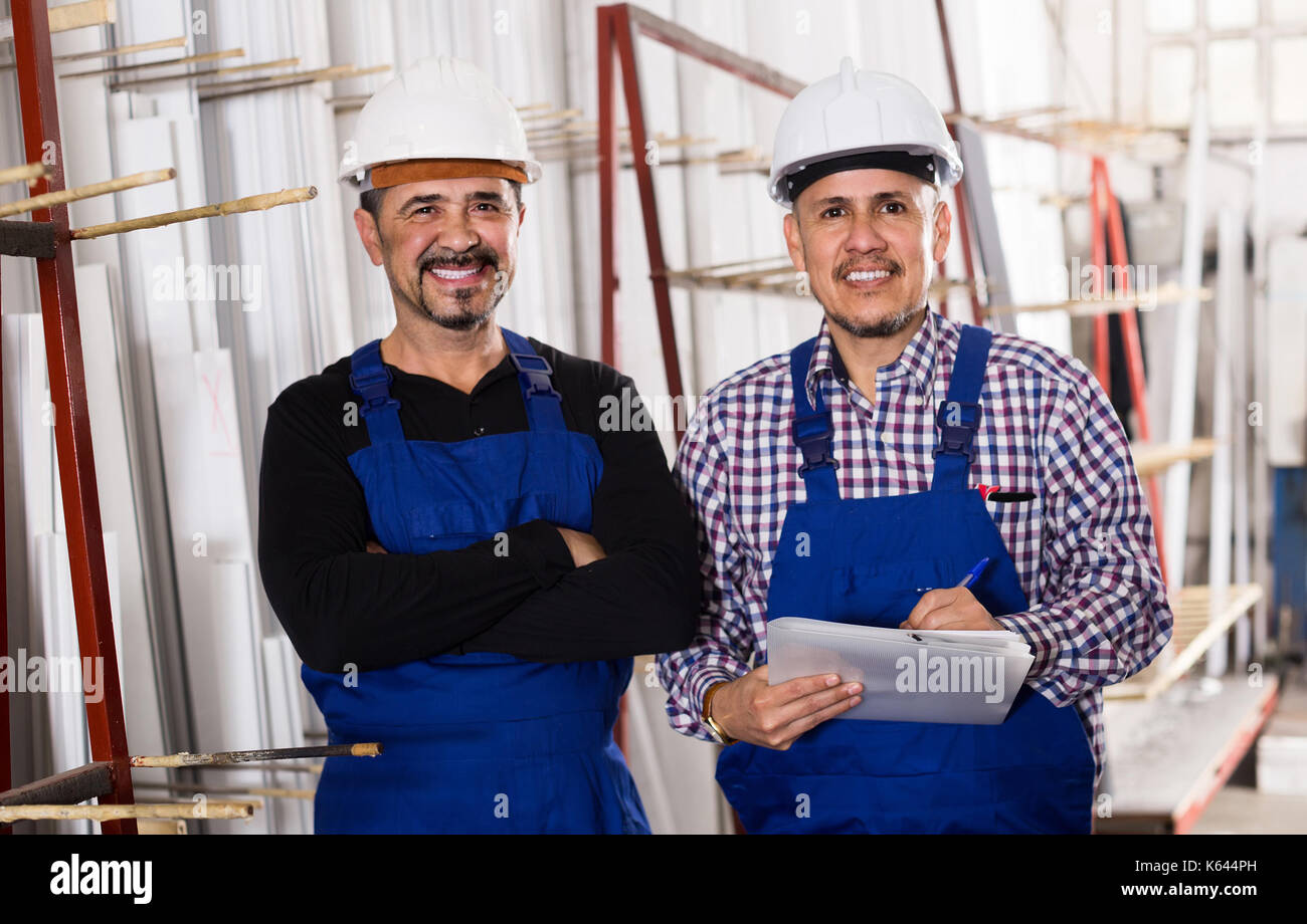 happy mechanical engineer inspecting the work of labour at modern ...