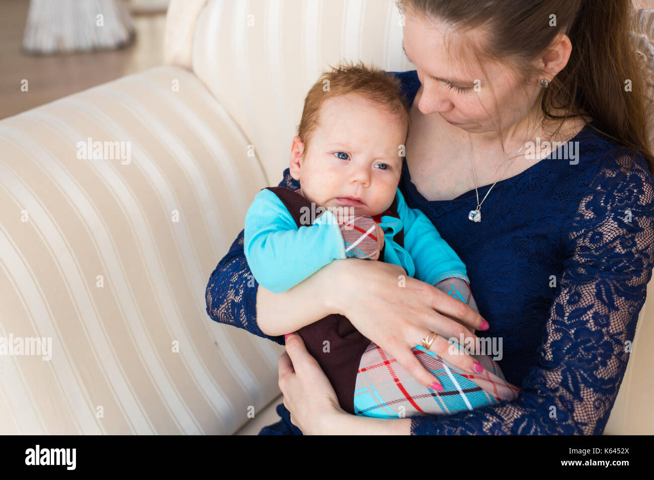 bright portrait of adorable baby boy and his mother Stock Photo - Alamy
