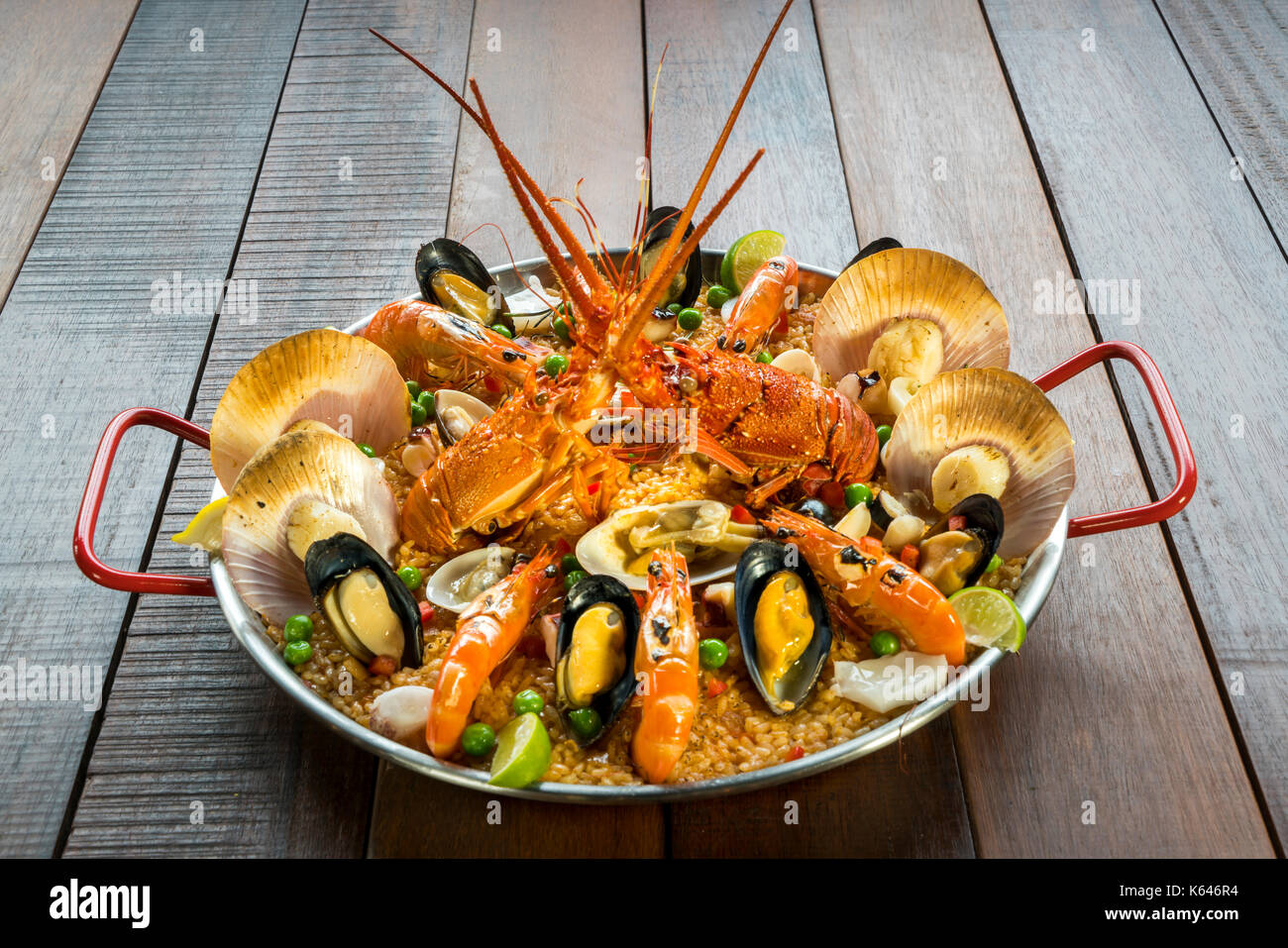 Gourmet seafood Valencia paella with fresh langoustine, clams, mussels ...
