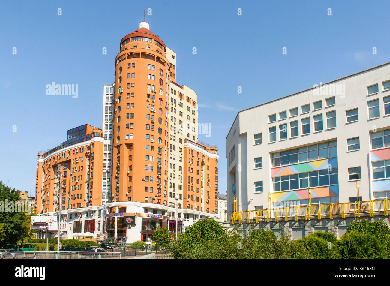 Kiev, Ukraine - August 2, 2012: High modern building (left) and School ...