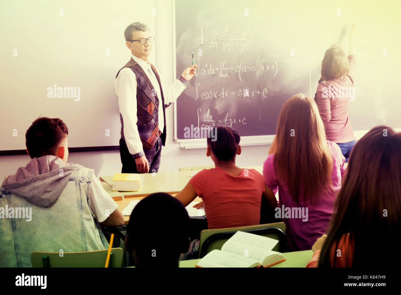 Pupils listening the explanation and answering to positive teacher in ...