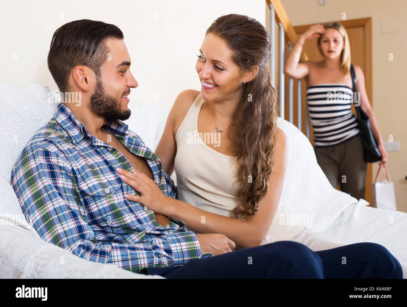Jealous young husband catching hi-res stock photography and images - Alamy