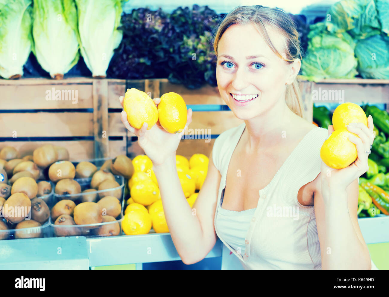 Woman selecting fresh lemon in hi-res stock photography and images - Alamy