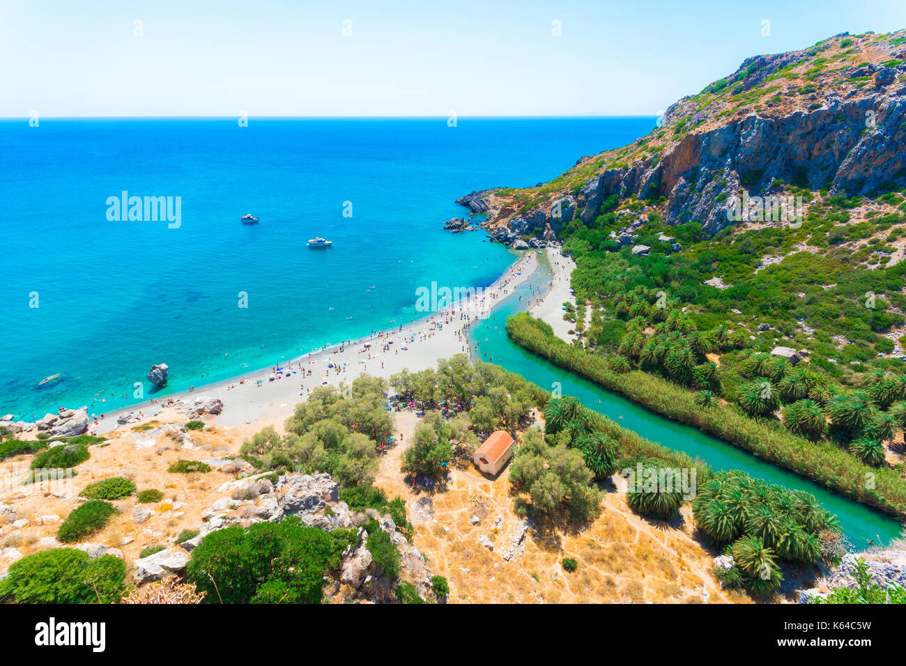 Panorama of Preveli beach at Libyan sea, river and palm forest ...