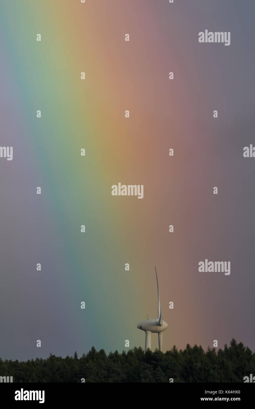 A colourful rainbow is visible behind a wind wheel in Ebing, Germany 11 ...