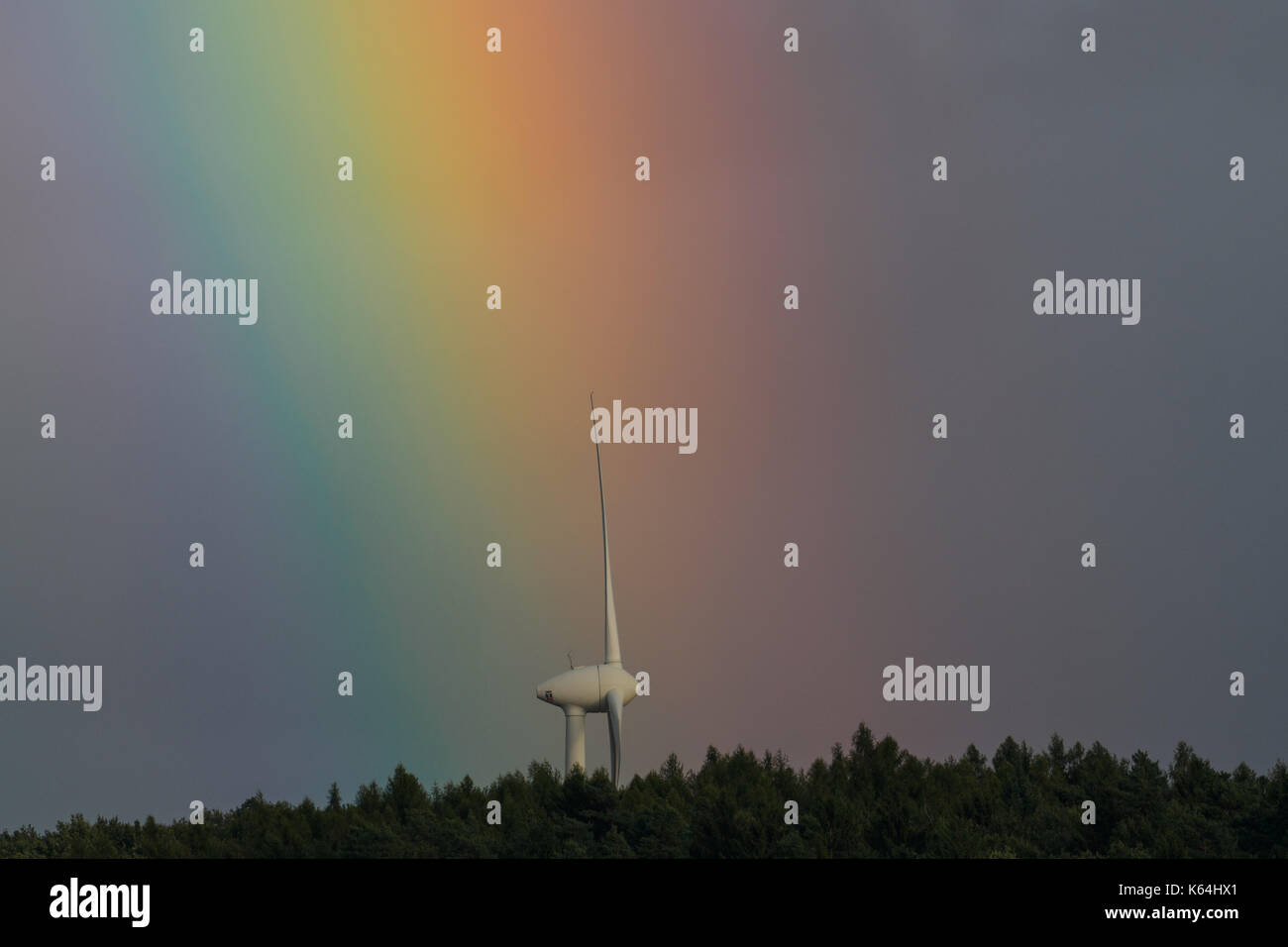 A colourful rainbow is visible behind a wind wheel in Ebing, Germany 11 ...