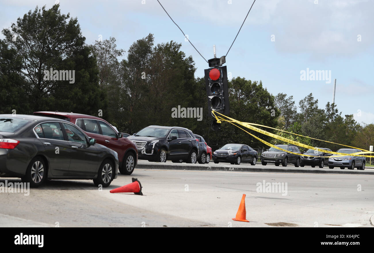 Plantation, FL, USA. 11th Sep, 2017. A traffic light hang loosely along ...