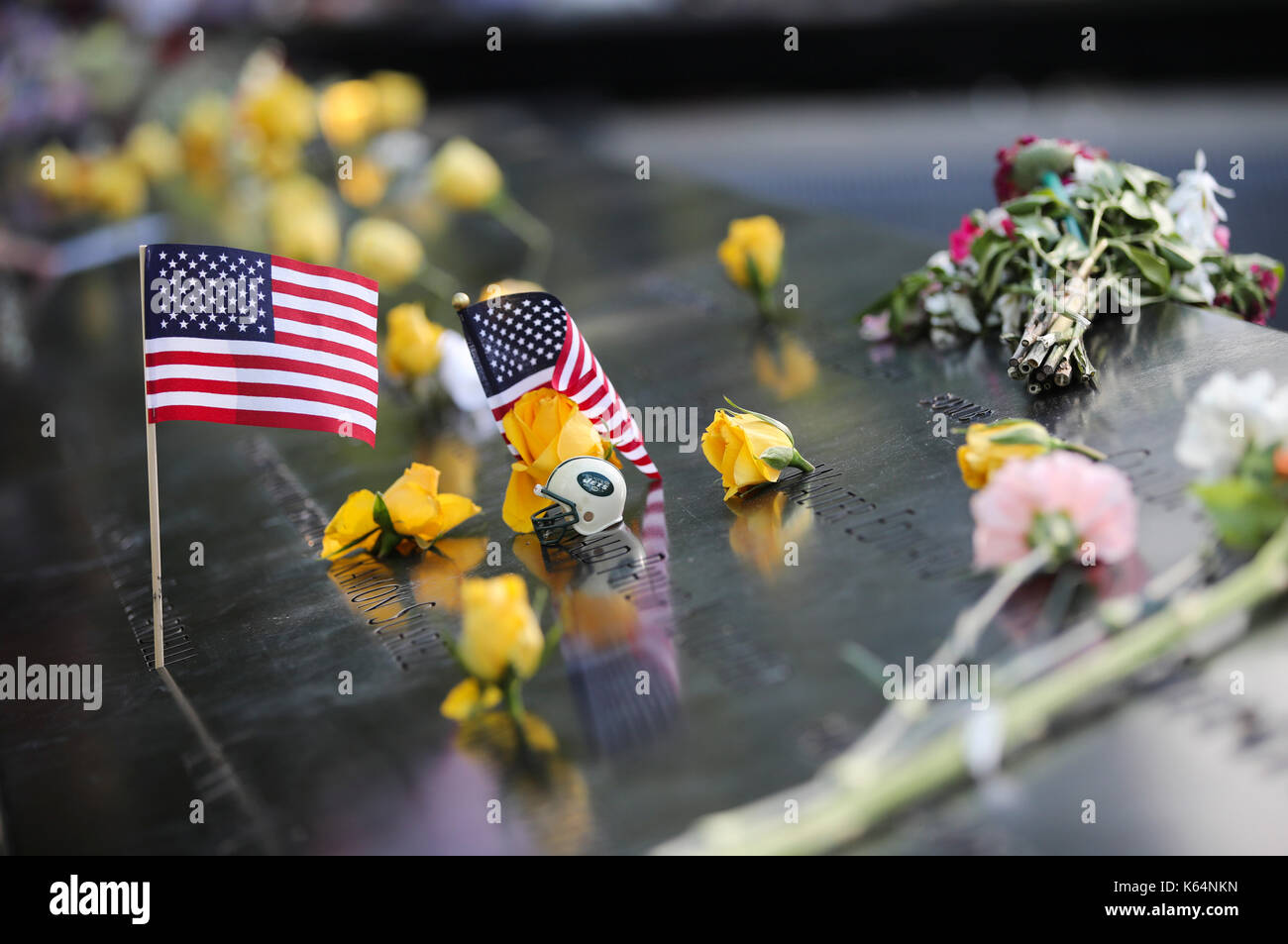 9 11 memorial with flowers and flags hi-res stock photography and ...