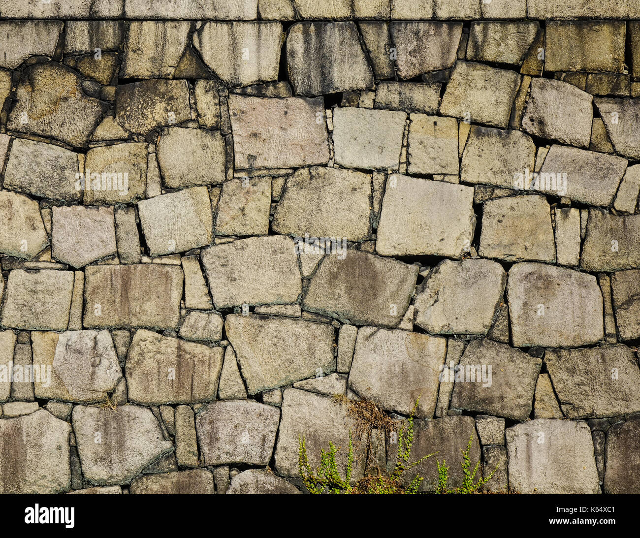 Ancient stone wall of Japanese castle in Osaka, Japan Stock Photo - Alamy