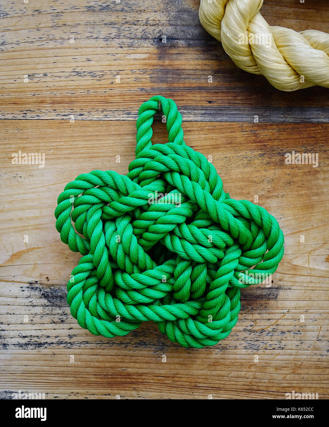 Rope knot hanging on the wooden wall for decoration in the Japanese ...