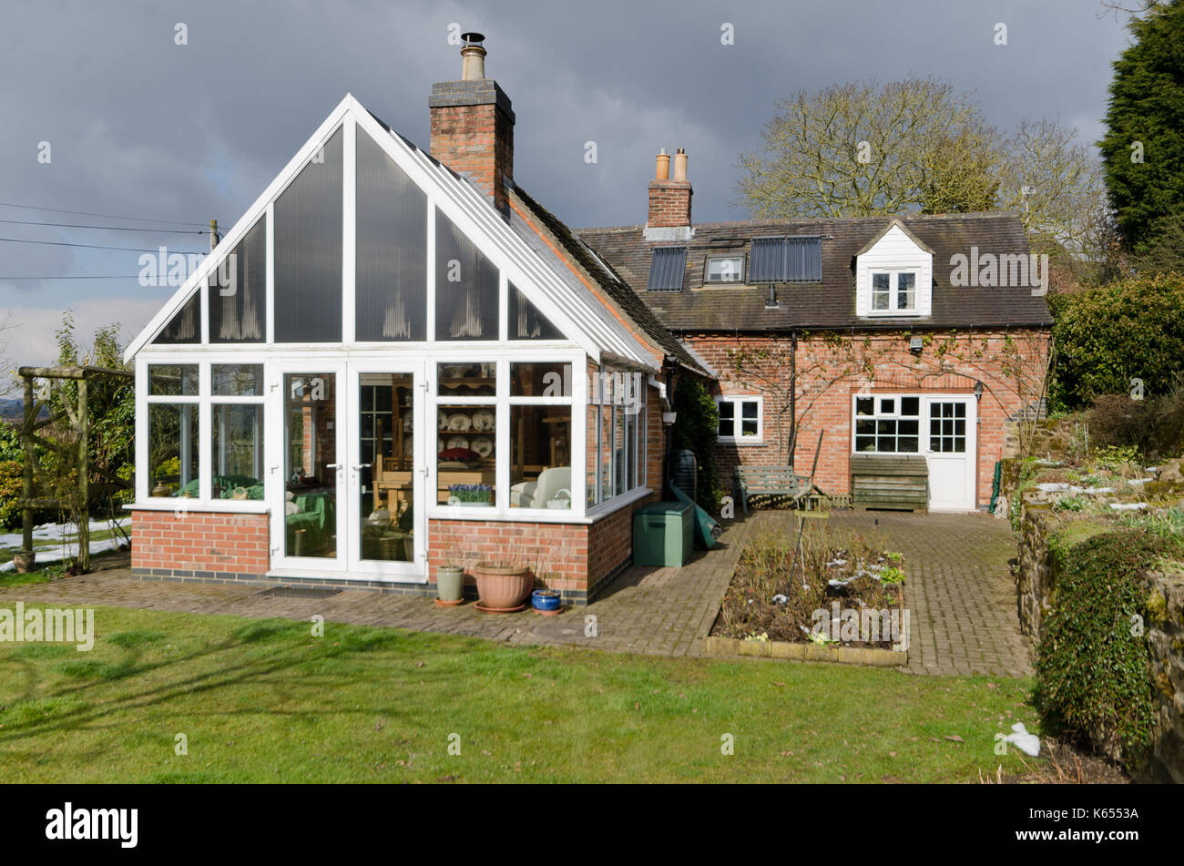 Large conservatory on Derbyshire cottage Stock Photo - Alamy