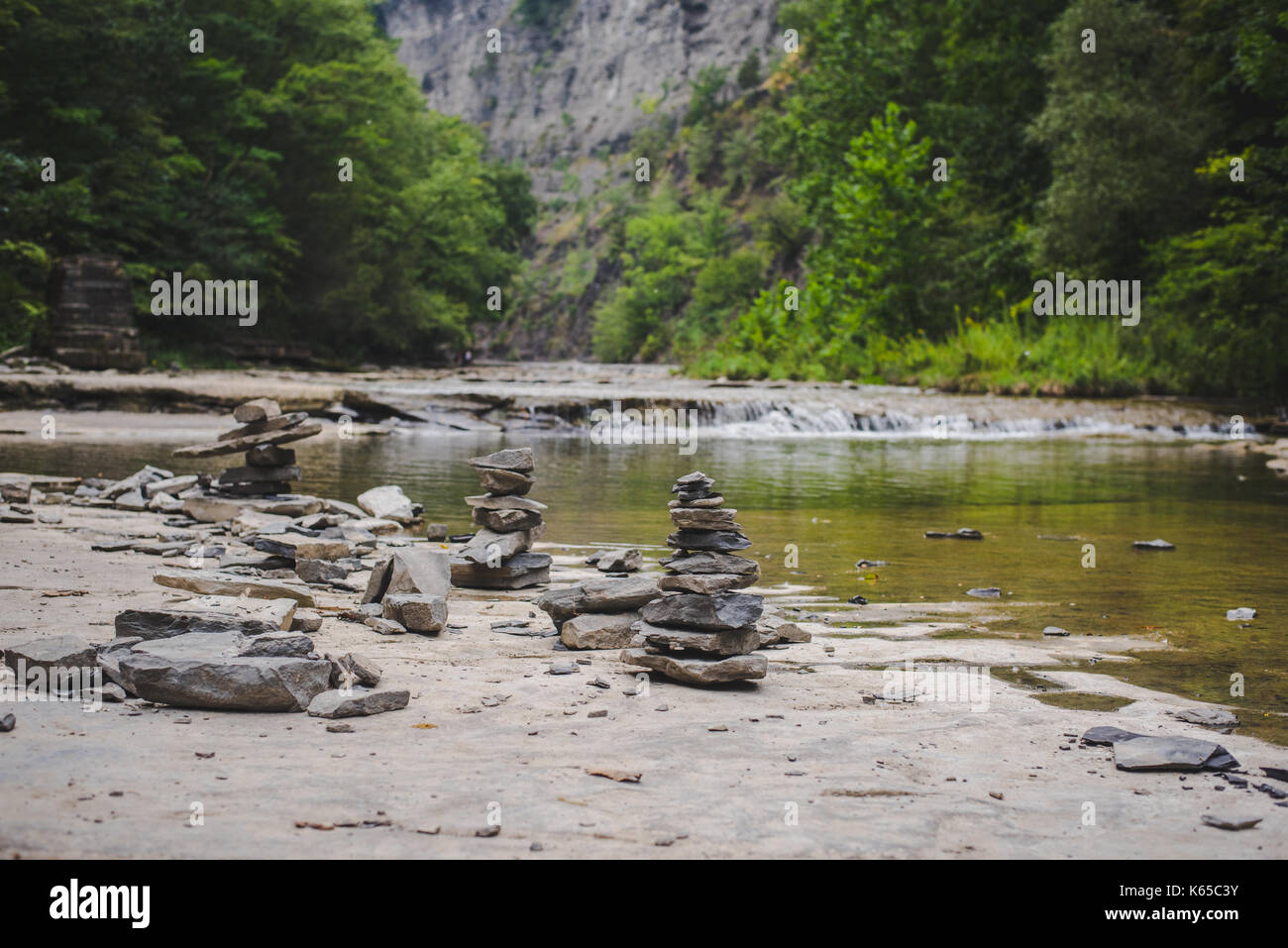 Trail markers sit along a stream in Upstate New York, Ithaca NY state ...