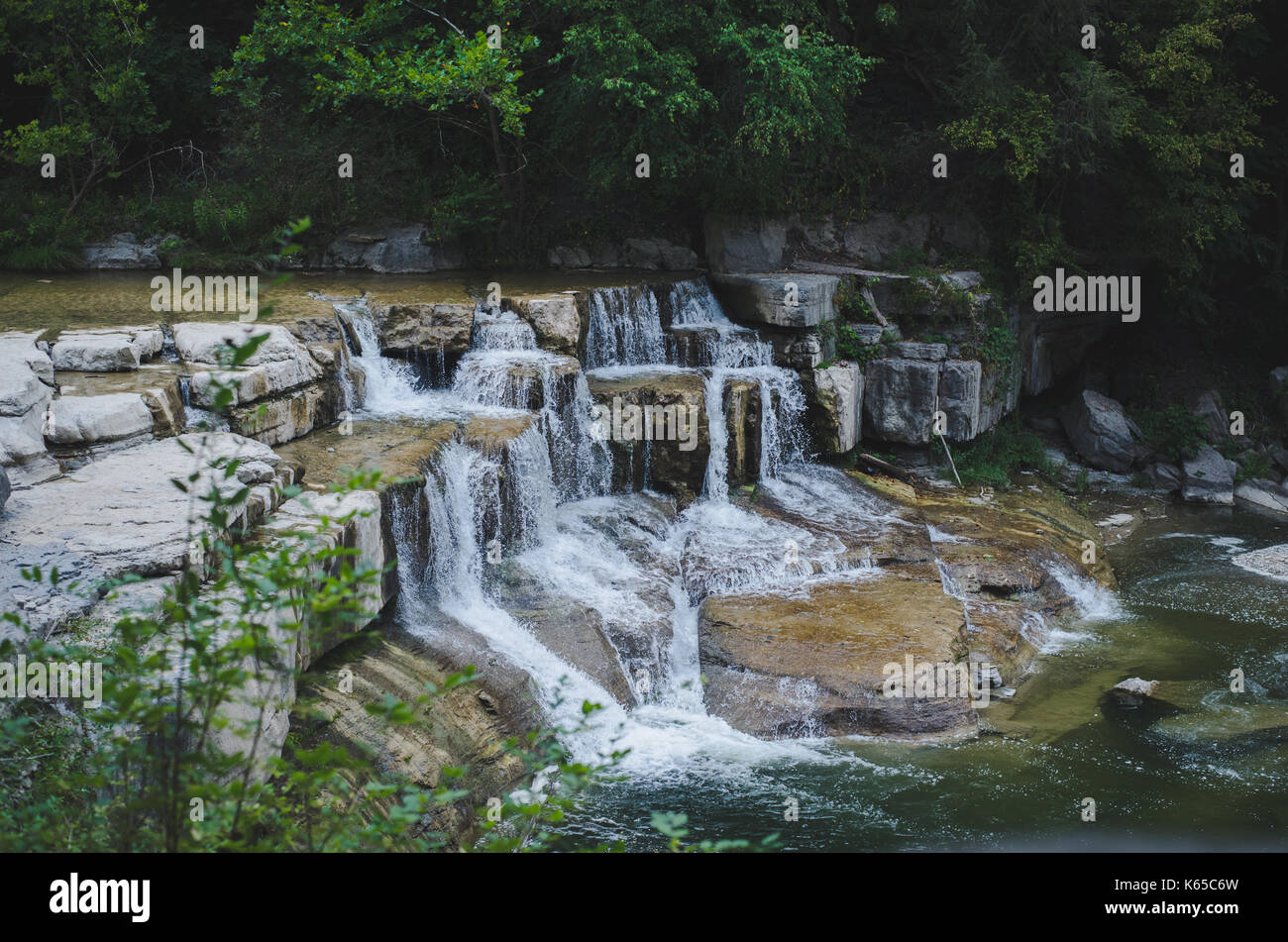 Water cascades down a series of waterfalls in Upstate New York, USA ...