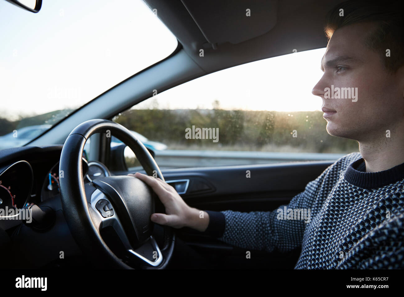 Interior View Of Young Man Driving Car On Motorway Stock Photo - Alamy