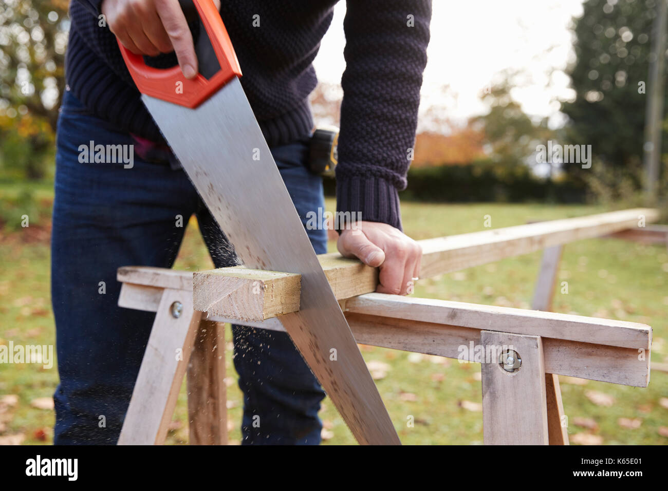 Man sawing wood hi-res stock photography and images - Alamy