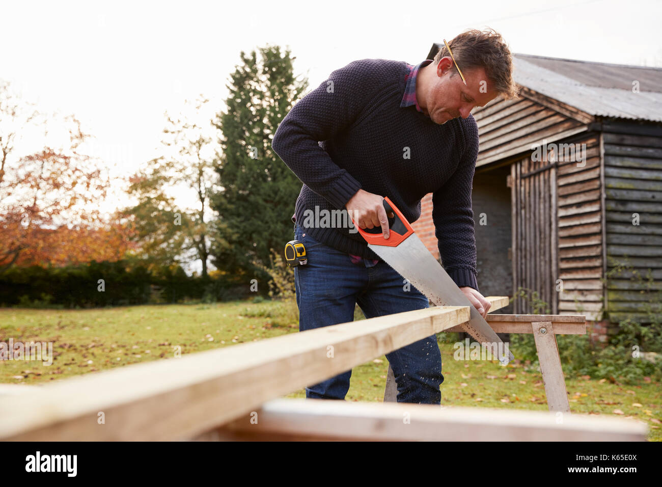 Sawing wood hi-res stock photography and images - Alamy